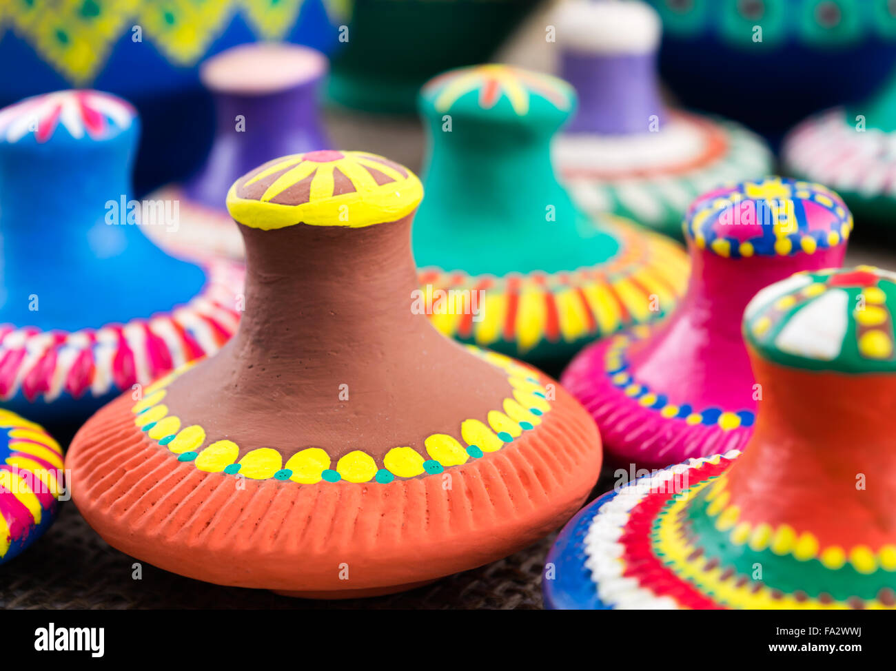 A group of painted handmade pottery vessels top covers Stock Photo - Alamy