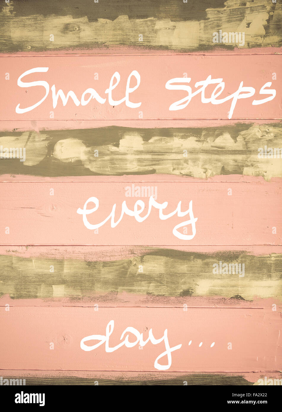 Concept image of Small Steps every day motivational quote hand written ...