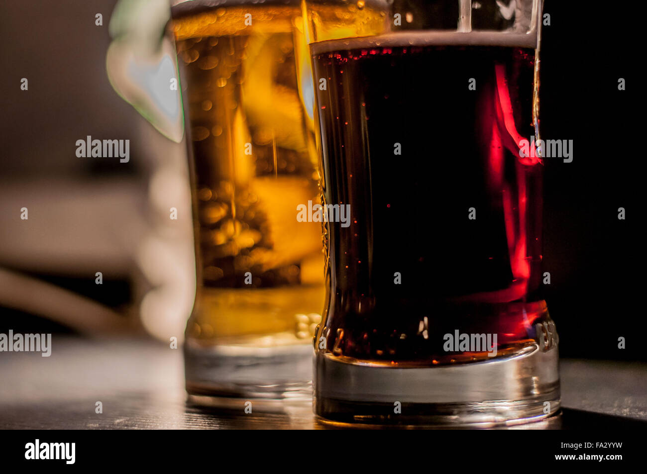 Red and yellow beer on a table Stock Photo - Alamy