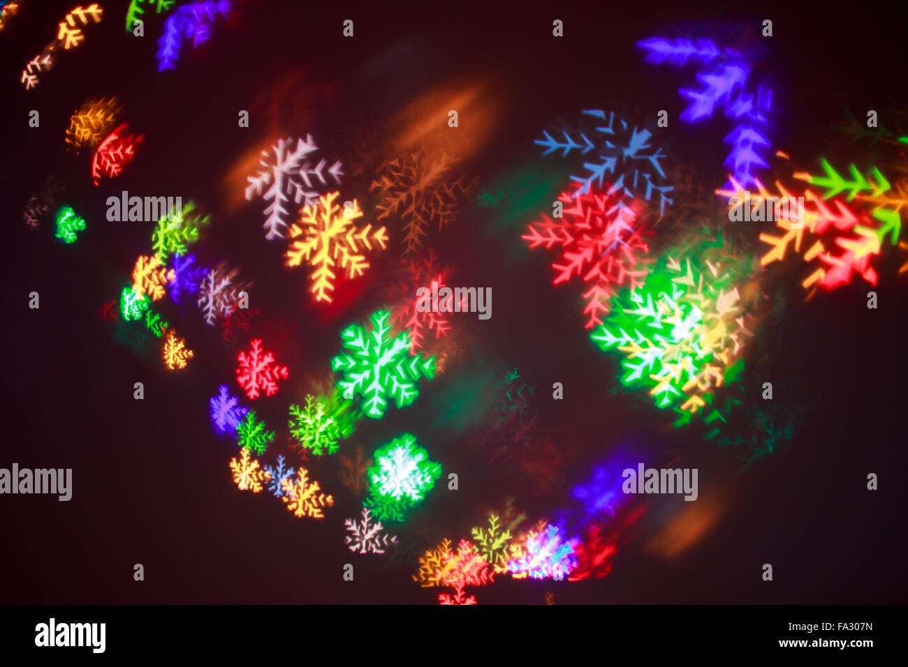 high quality snowflake light leak.. on dark background Stock Photo - Alamy
