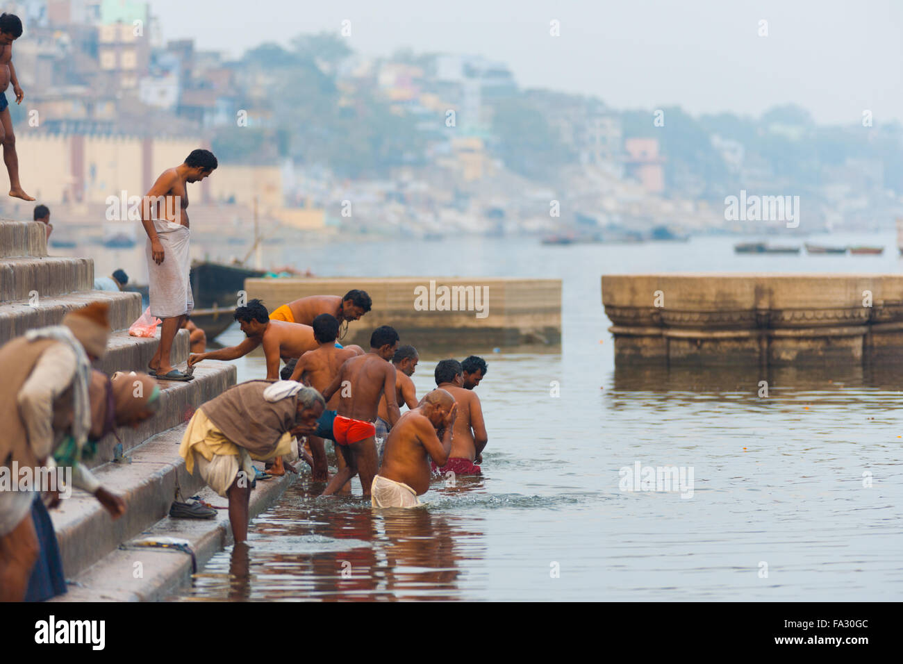 Indian men bathing in ganges hi-res stock photography and images - Alamy