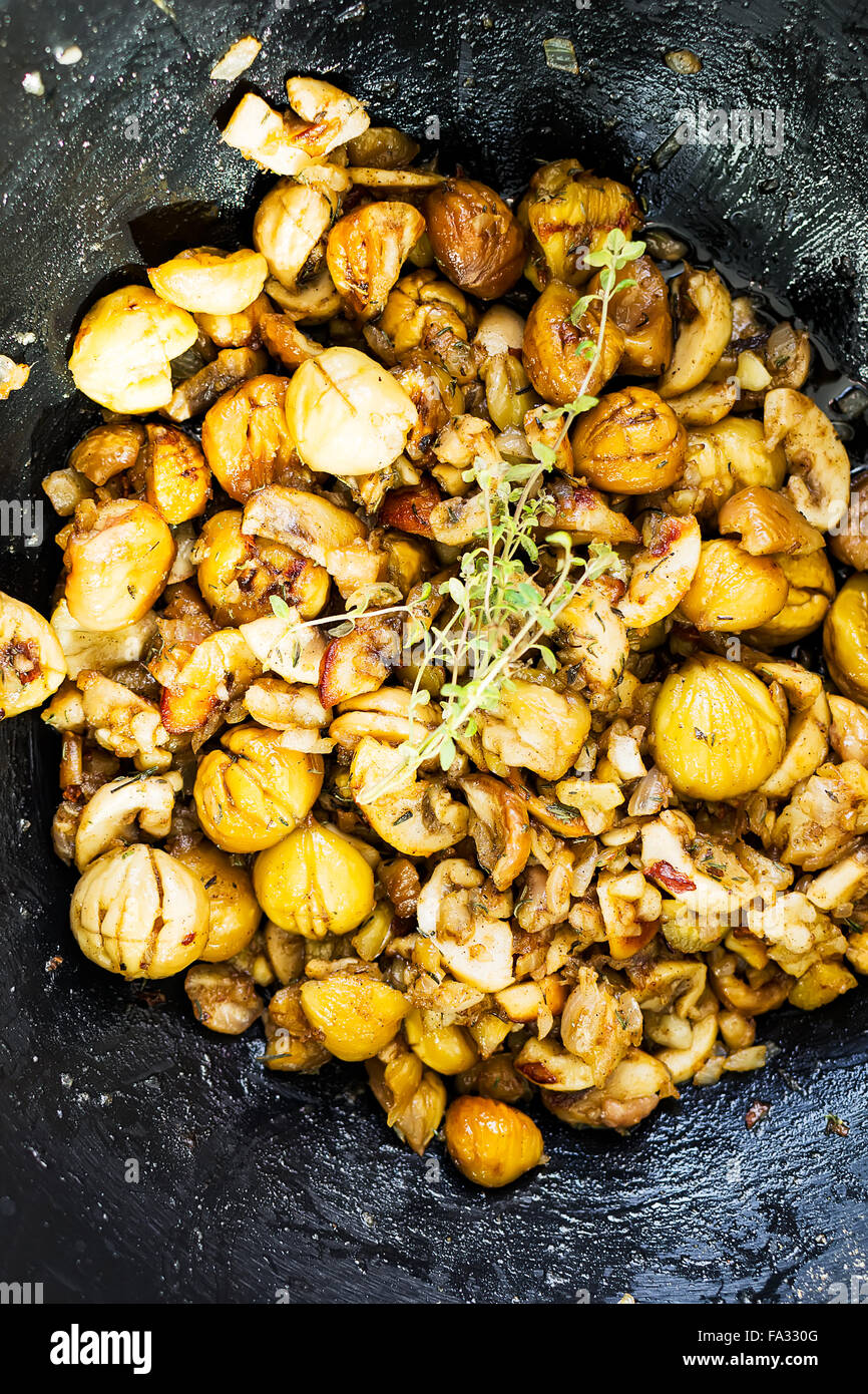 Pan-fried chestnuts with mushrooms and spices Stock Photo - Alamy