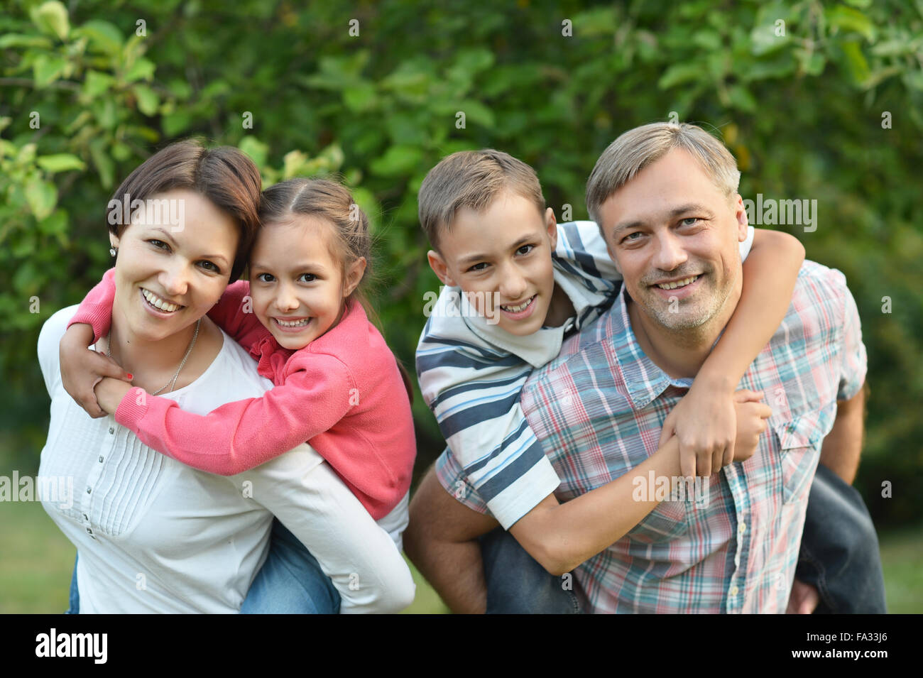 Family resting in summer park Stock Photo - Alamy