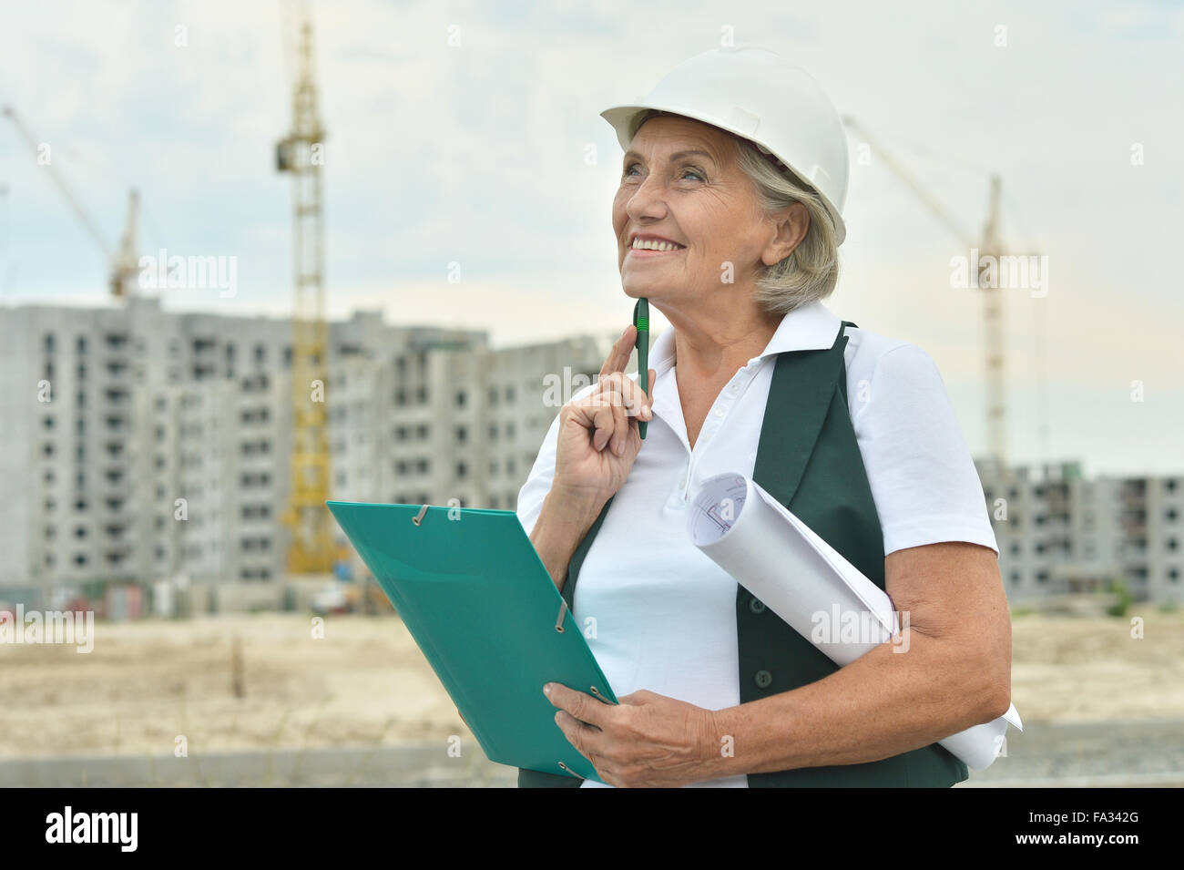 Senior woman in under construction Stock Photo - Alamy