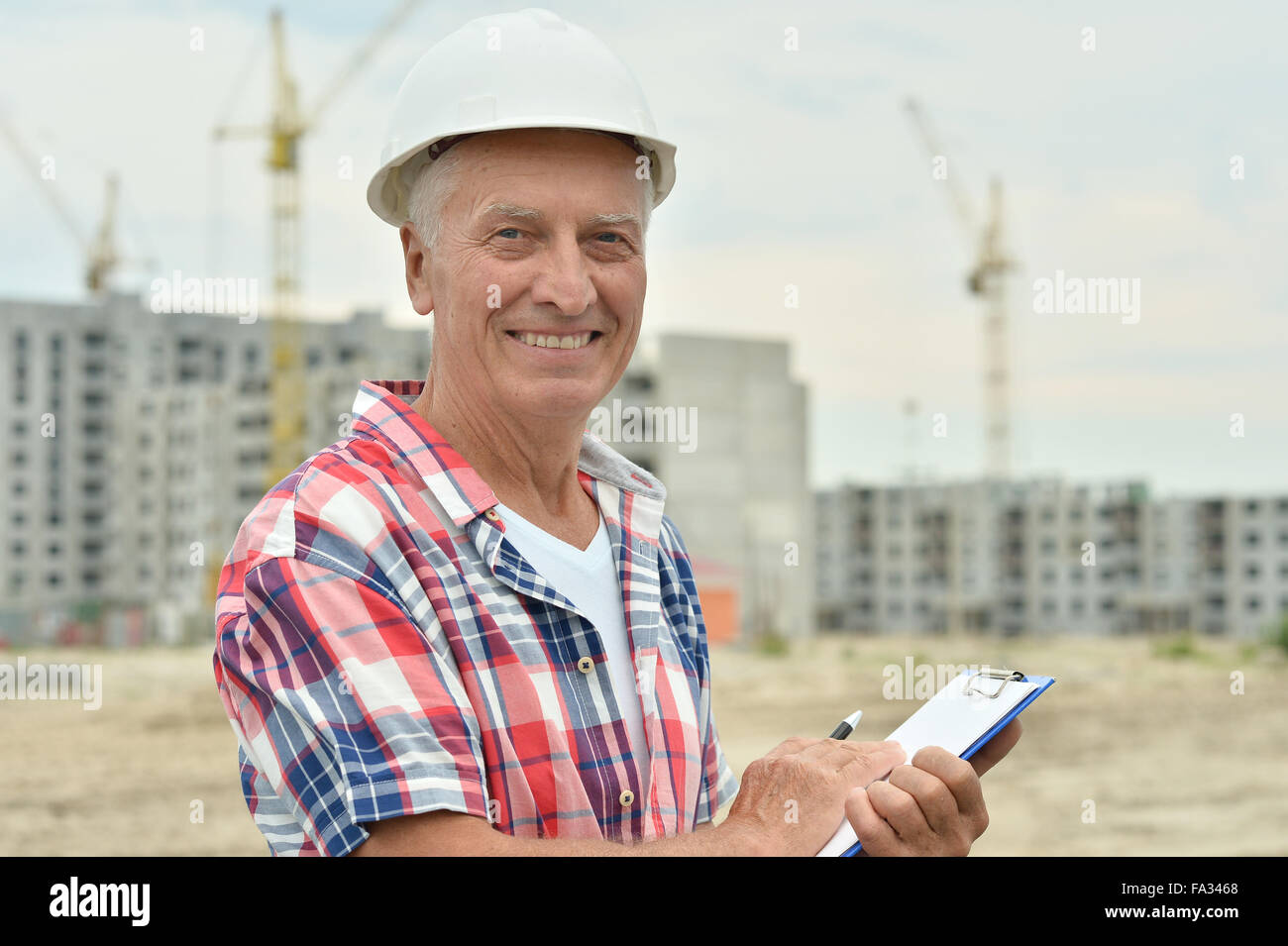 Senior man in under construction Stock Photo - Alamy