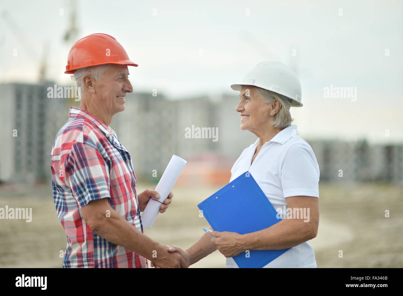 Senior couple in under construction Stock Photo - Alamy