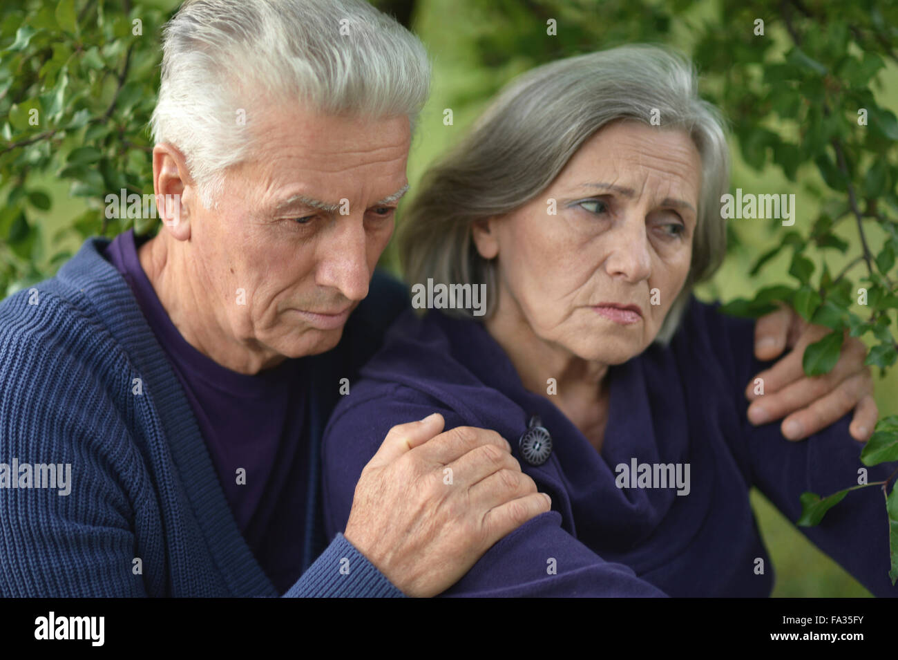 sad elder couple Stock Photo - Alamy