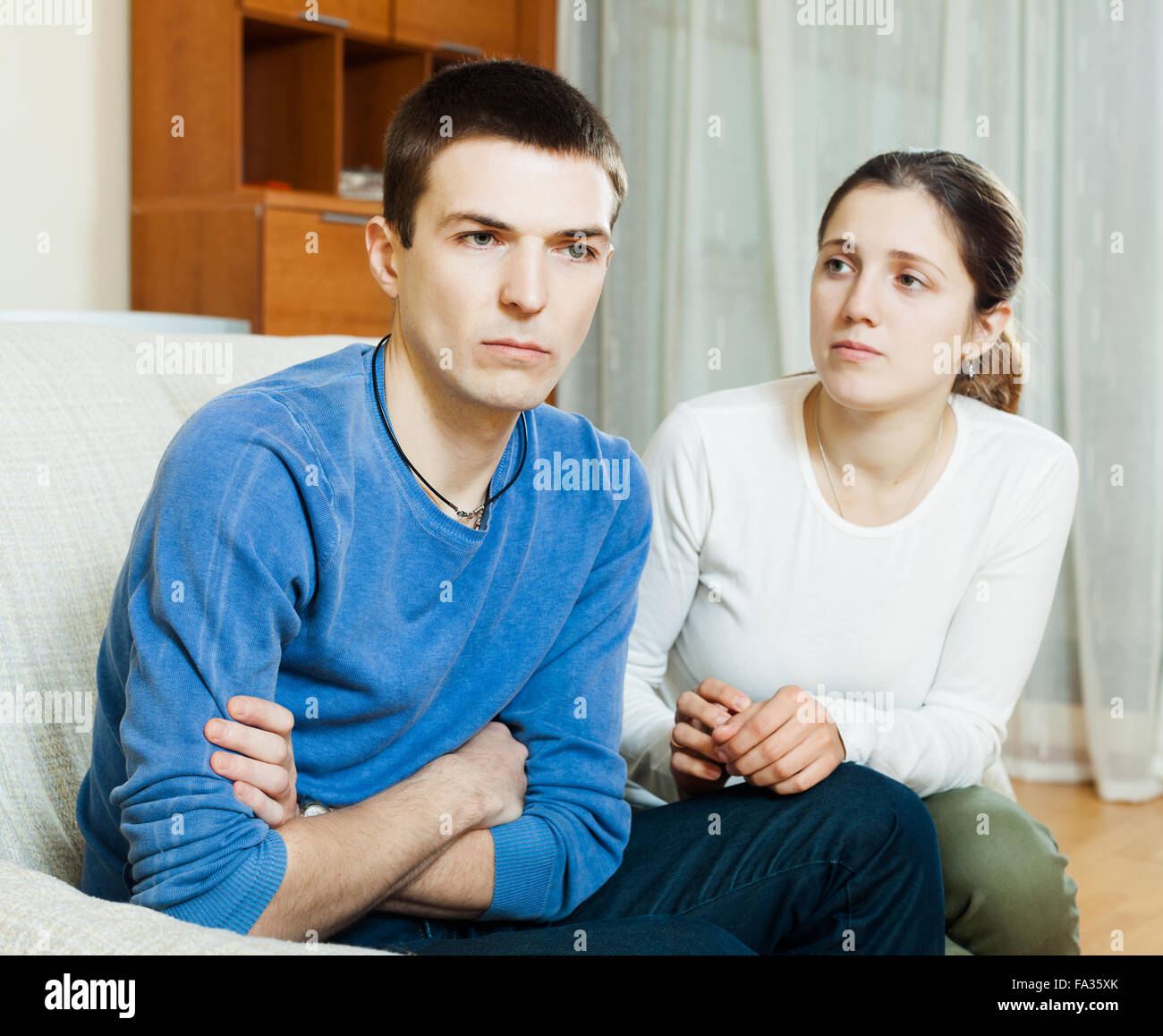Sadness young couple having problems at home Stock Photo - Alamy