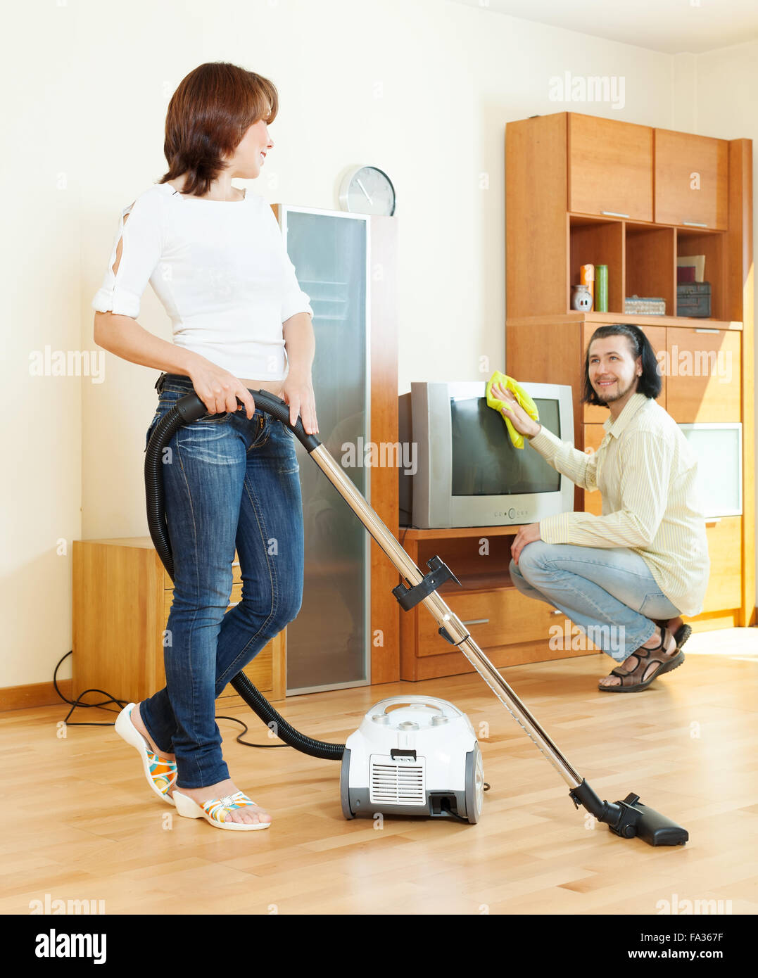 amicable couple doing housework together Stock Photo - Alamy