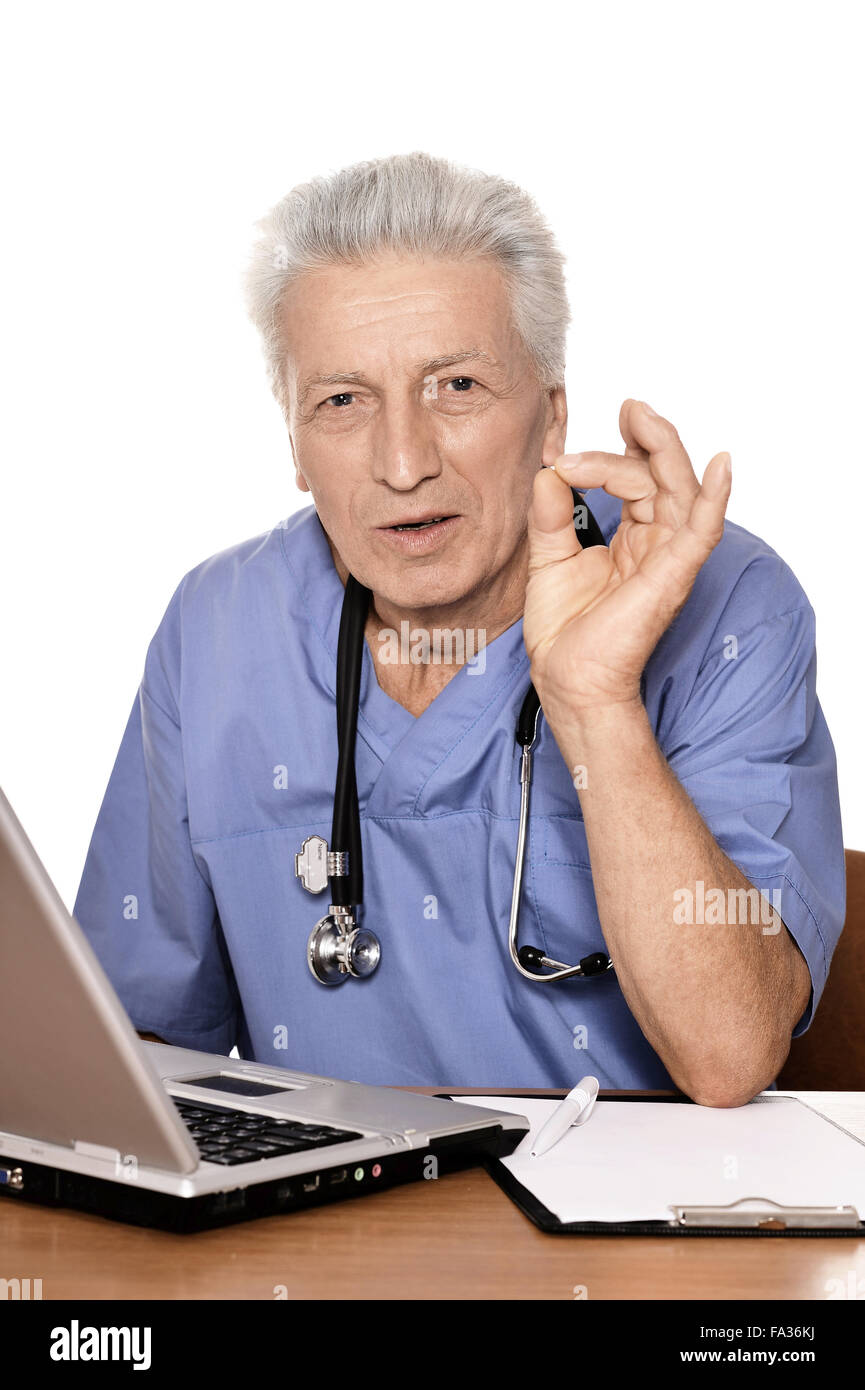 Elderly doctor with laptop Stock Photo - Alamy