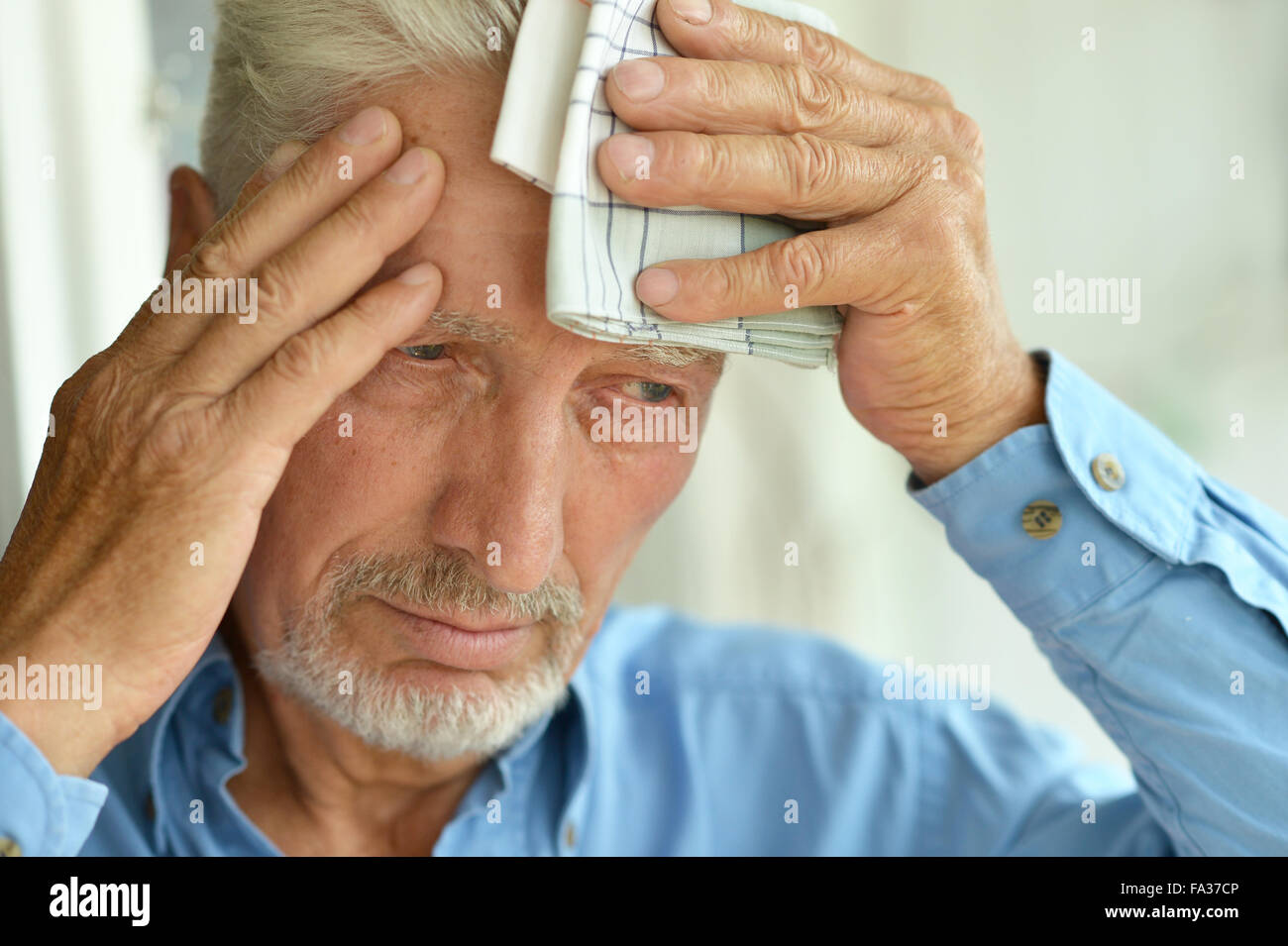 Sick elderly man Stock Photo - Alamy