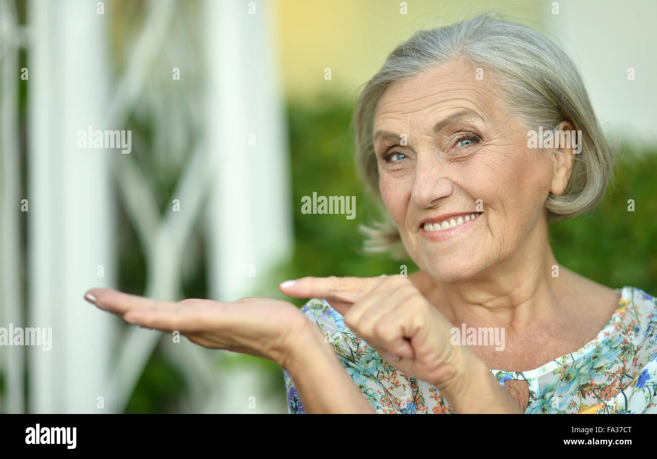 Older woman pointing Stock Photo - Alamy