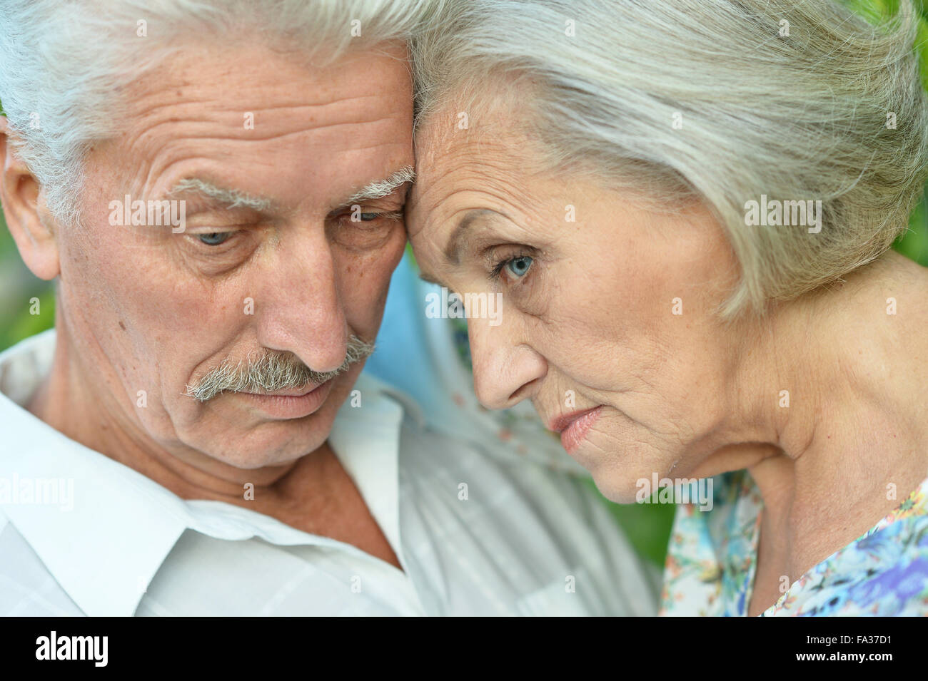 Sad senior couple Stock Photo - Alamy