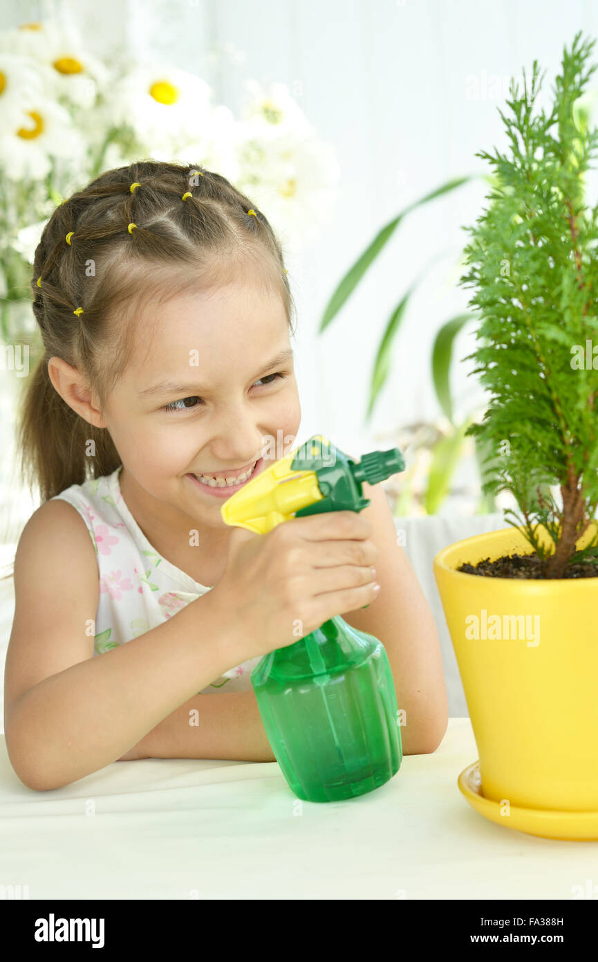 Beautiful little girl with water spray Stock Photo - Alamy