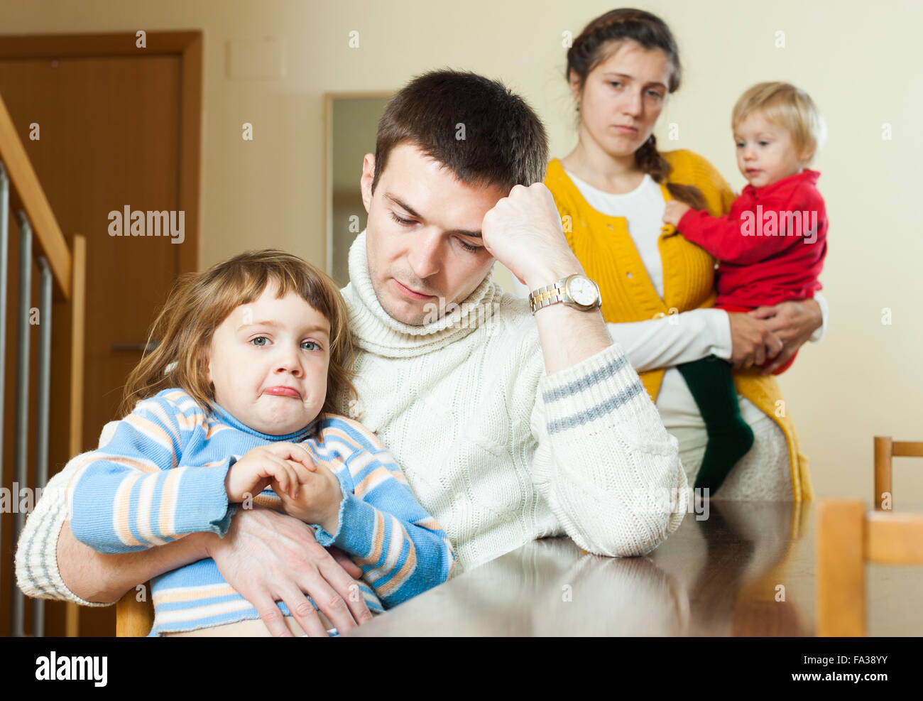 Family with two children having quarrel at home Stock Photo - Alamy