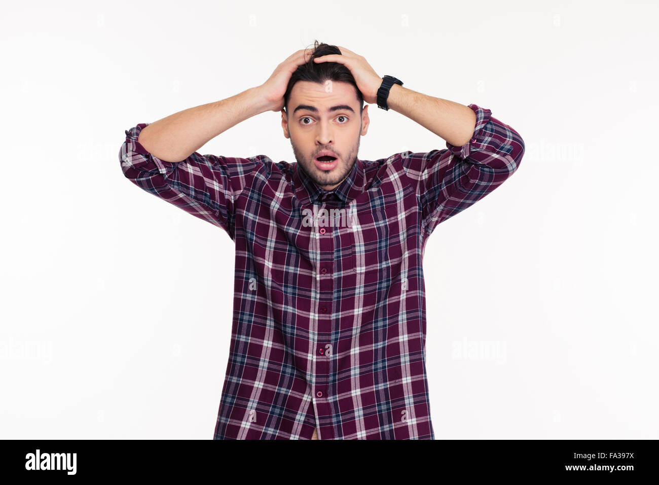Portrait of a scared man looking at camera isolated on a white ...