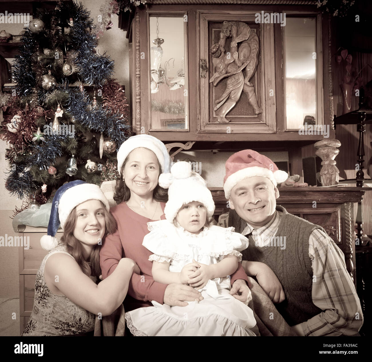 Old photo of happy married couple with child visiting mom for Christmas ...