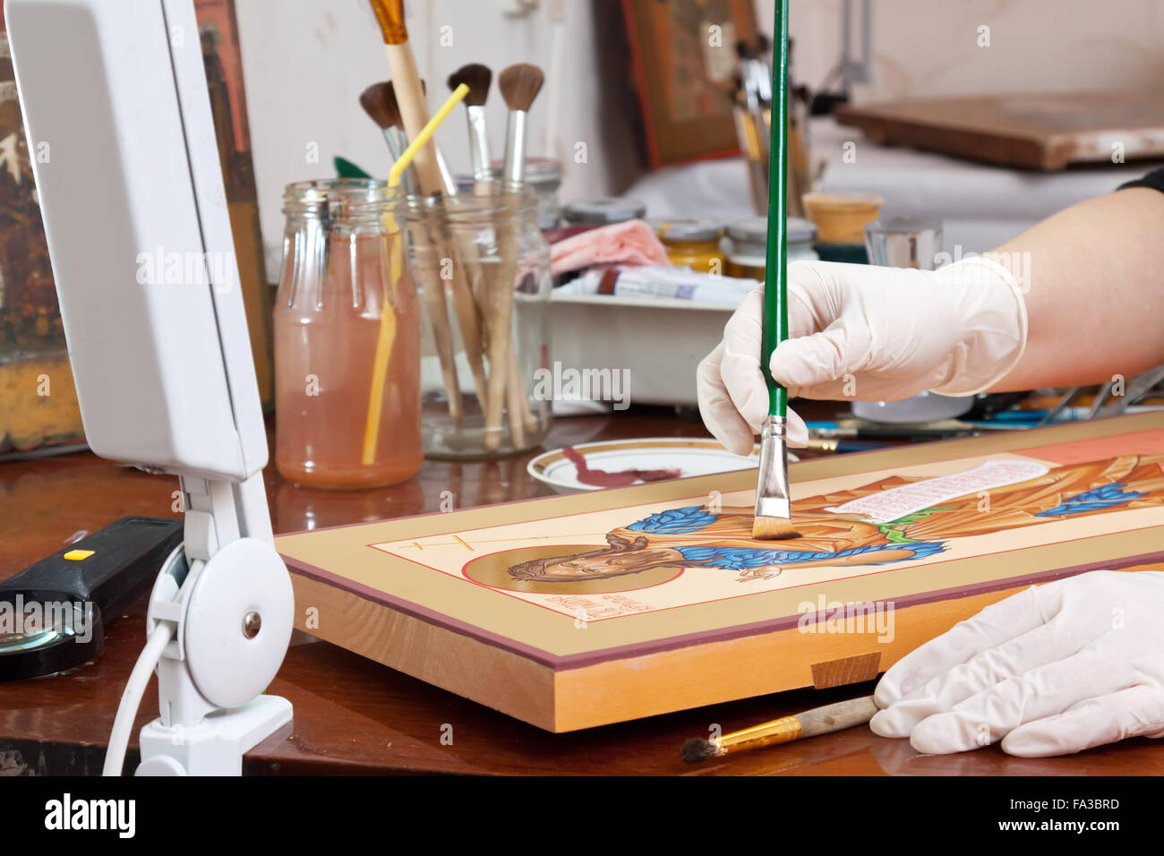 Closeup of Iconographer makes new icon Stock Photo - Alamy