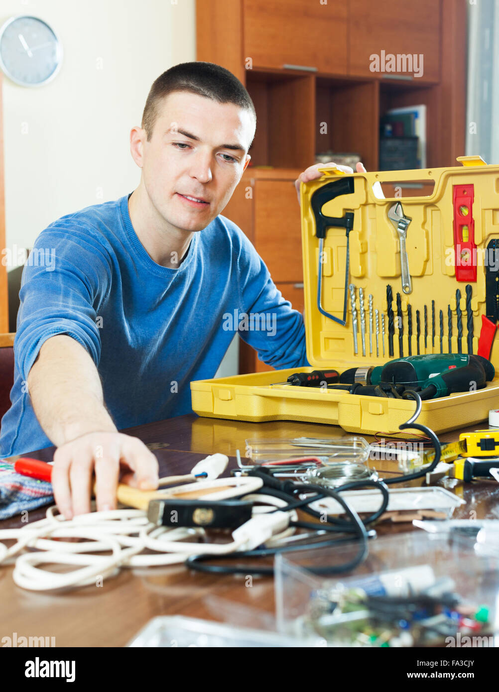 Man sitting on toolbox hi-res stock photography and images - Alamy