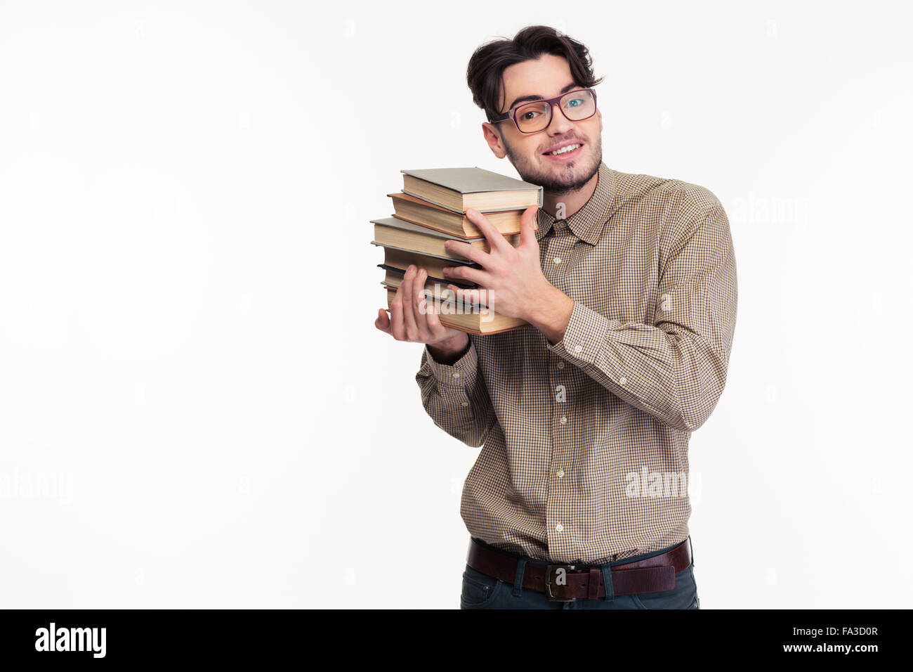 Portrait of a happy casual man holding books isolated on a white ...