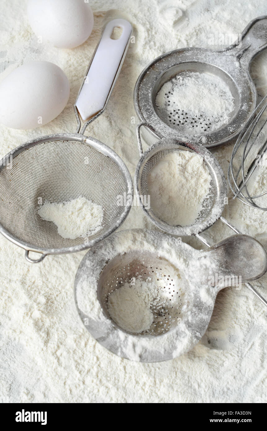Kitchen utensils and wheat flour on the table Stock Photo - Alamy