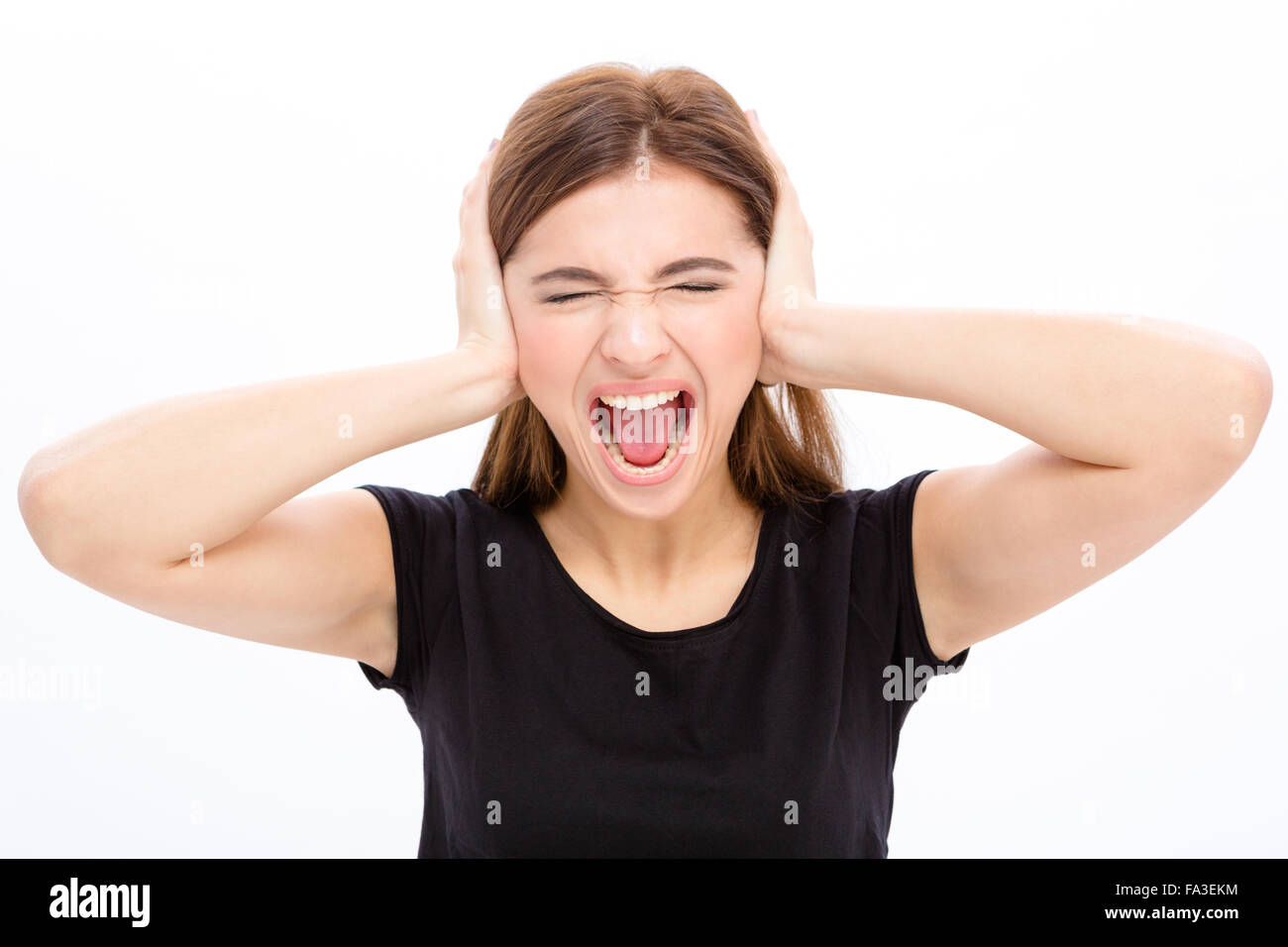 Angry irritated young woman with closed eyes covered ears by hands and ...