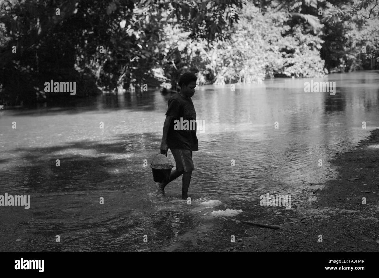 West Papua. 29th May, 2015. An woman of an OPM commander carries water ...