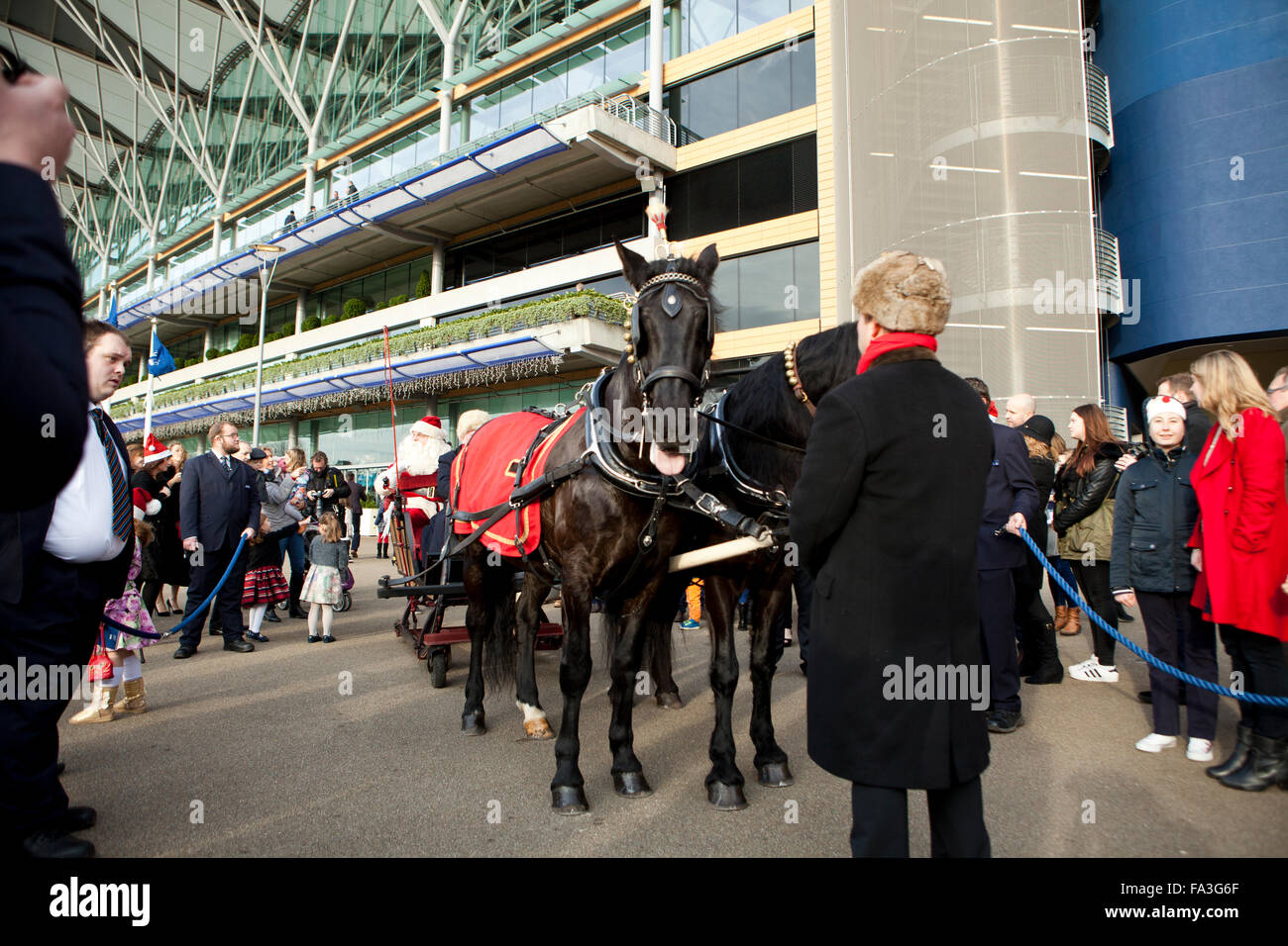 Ascot racecourse, Horse racing-Father Christmas and Mrs Claus watching ...