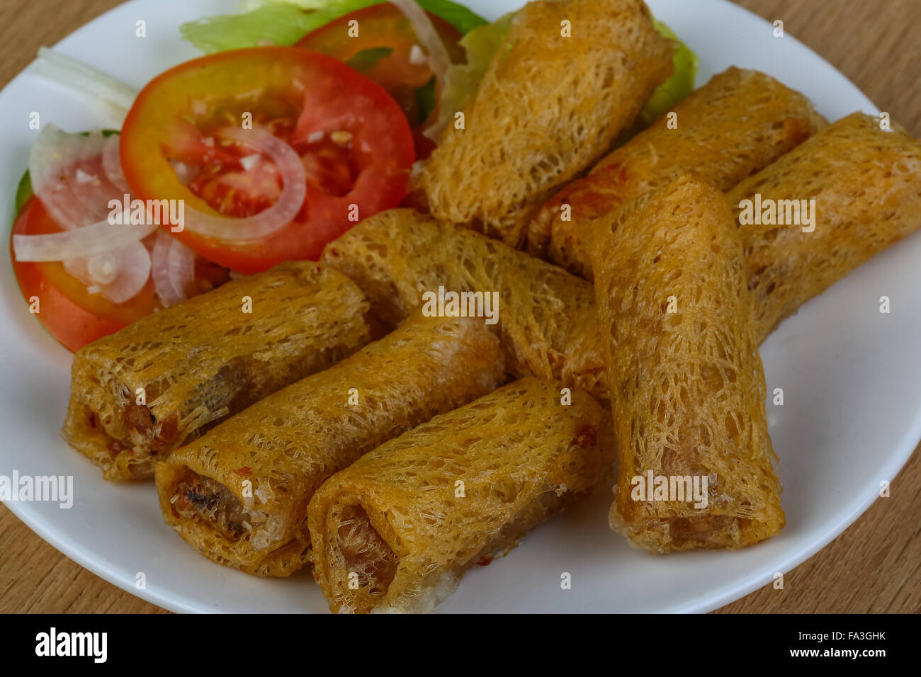 Asian traditional spring rolls on the wood background Stock Photo - Alamy