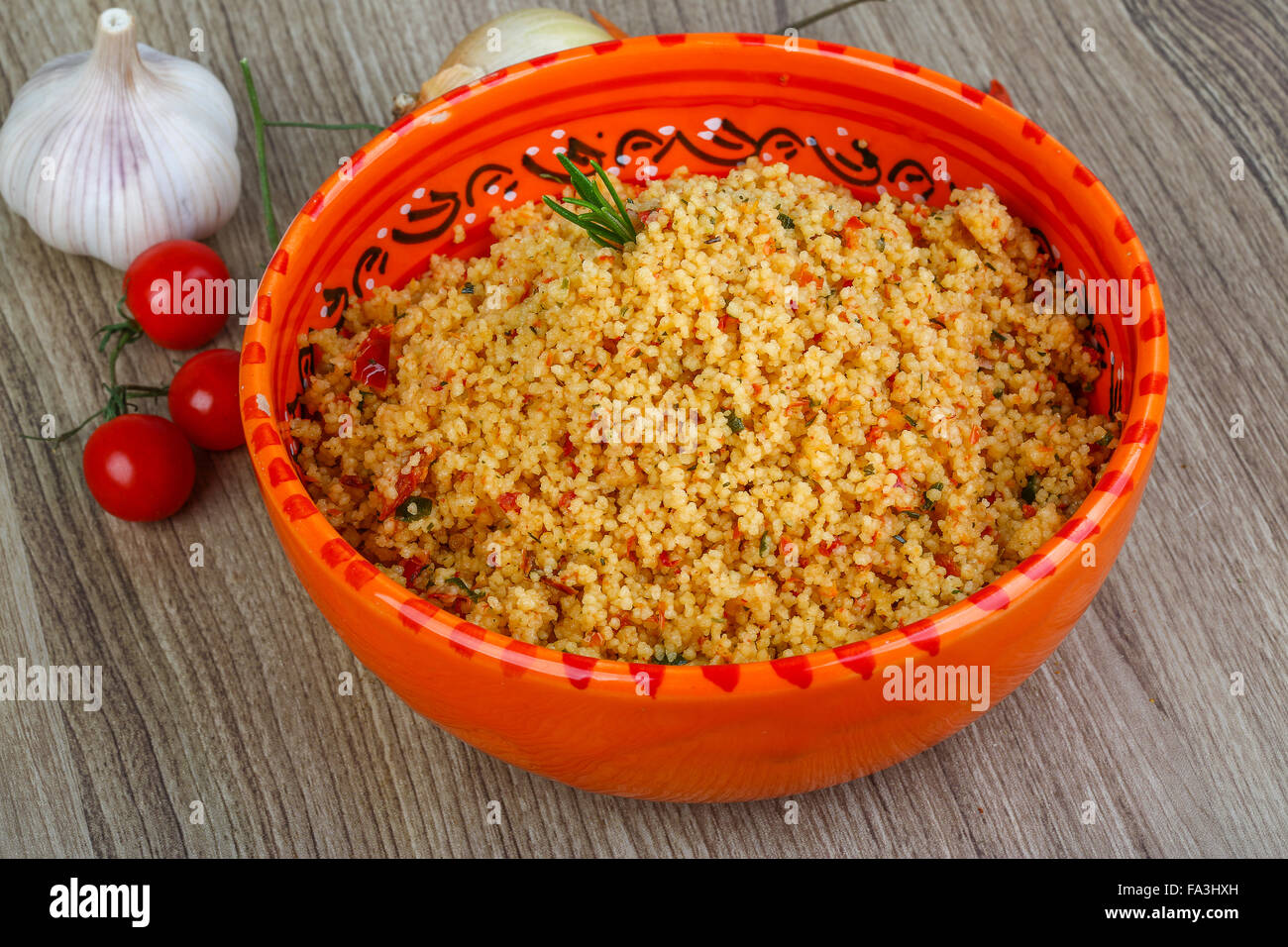 Arabic traditional cuisine - Couscous with tomato and green onion Stock ...