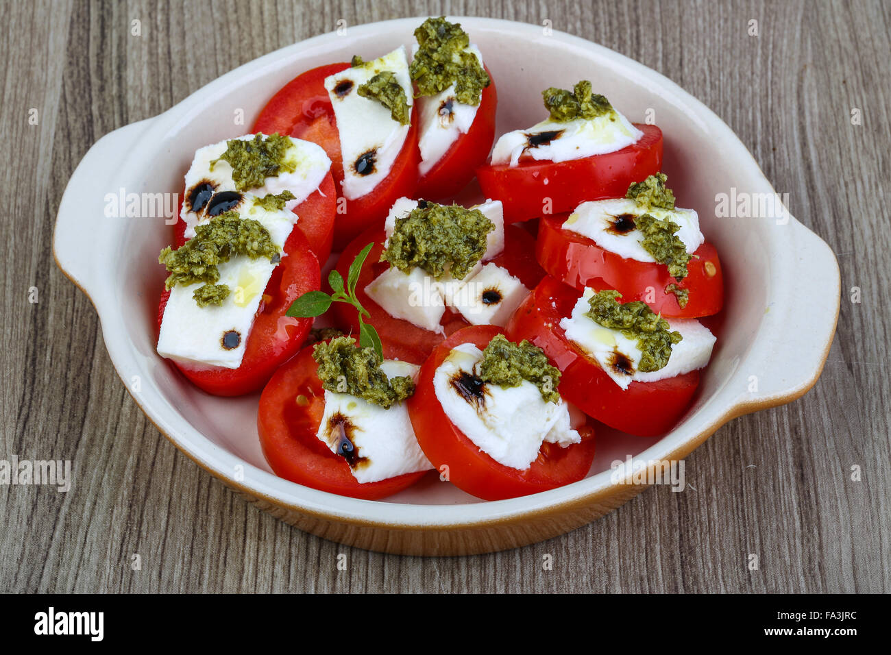 Traditional Italian Caprese salad on the wood background Stock Photo ...