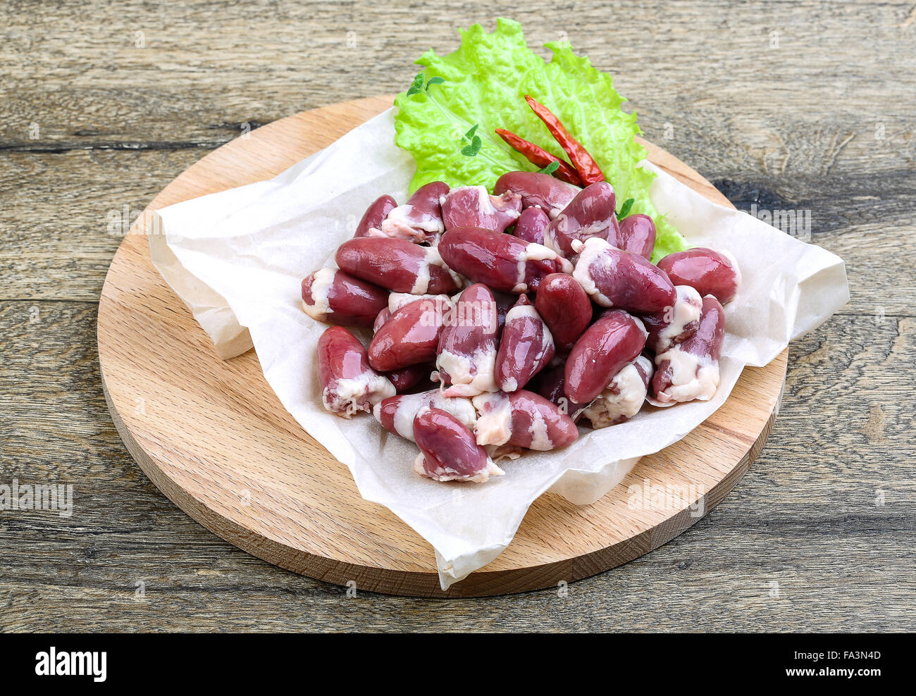 Raw chicken hearts ready for cooking on the wood background Stock Photo ...