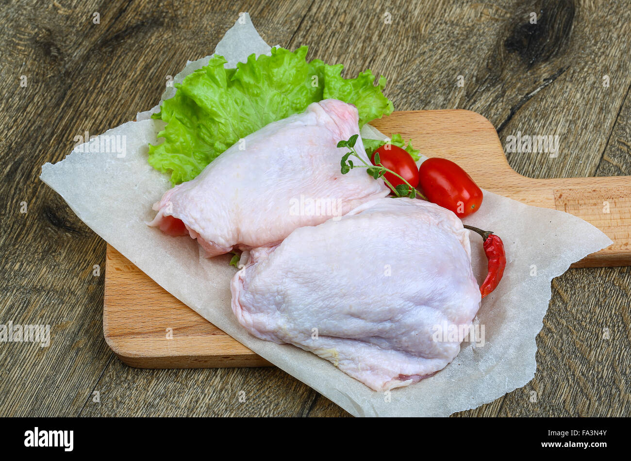Raw chicken legs meat with herbs and spices ready for cooking Stock ...