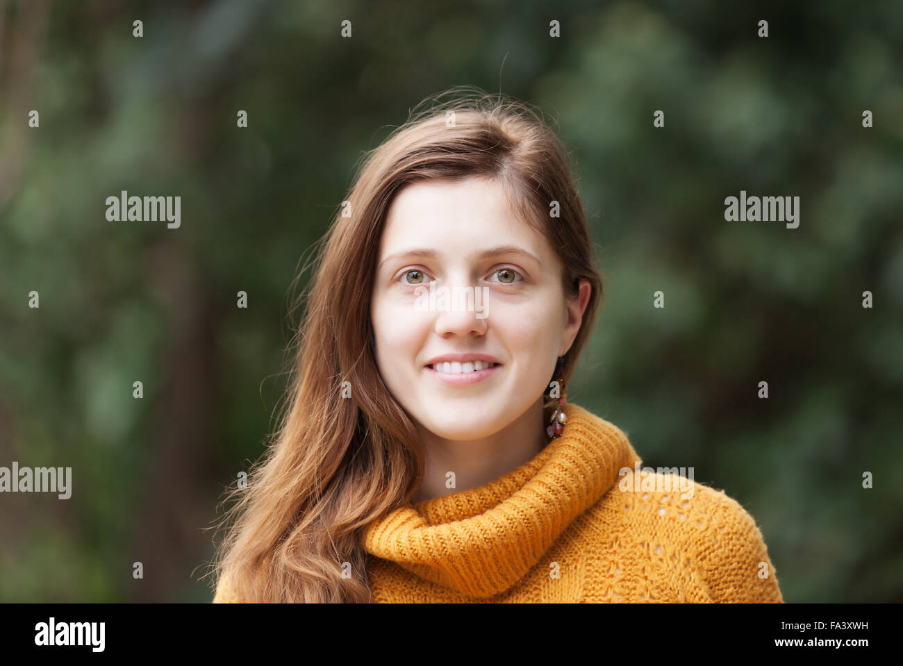Portrait of smiling woman outdoor Stock Photo - Alamy