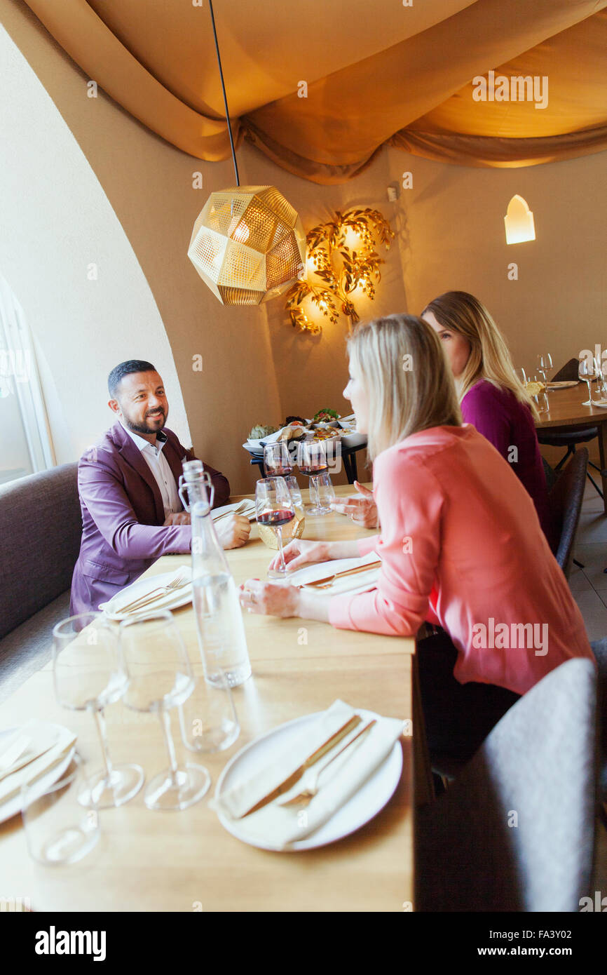Friends talking while sitting at Lebanese restaurant Stock Photo - Alamy