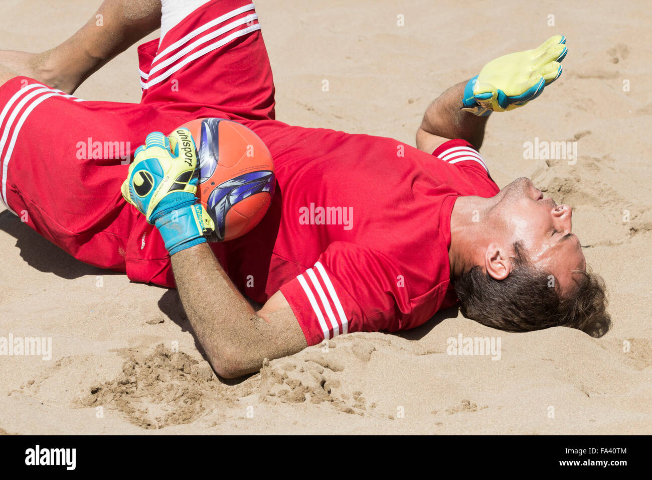 Injured goalkeeper at beach football tournament in Spain Stock Photo ...