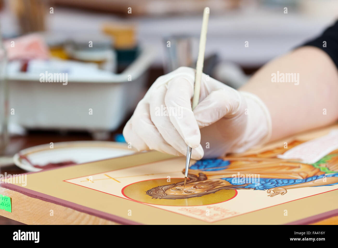 Closeup of painting of new Christian icon with brush at workshop Stock ...