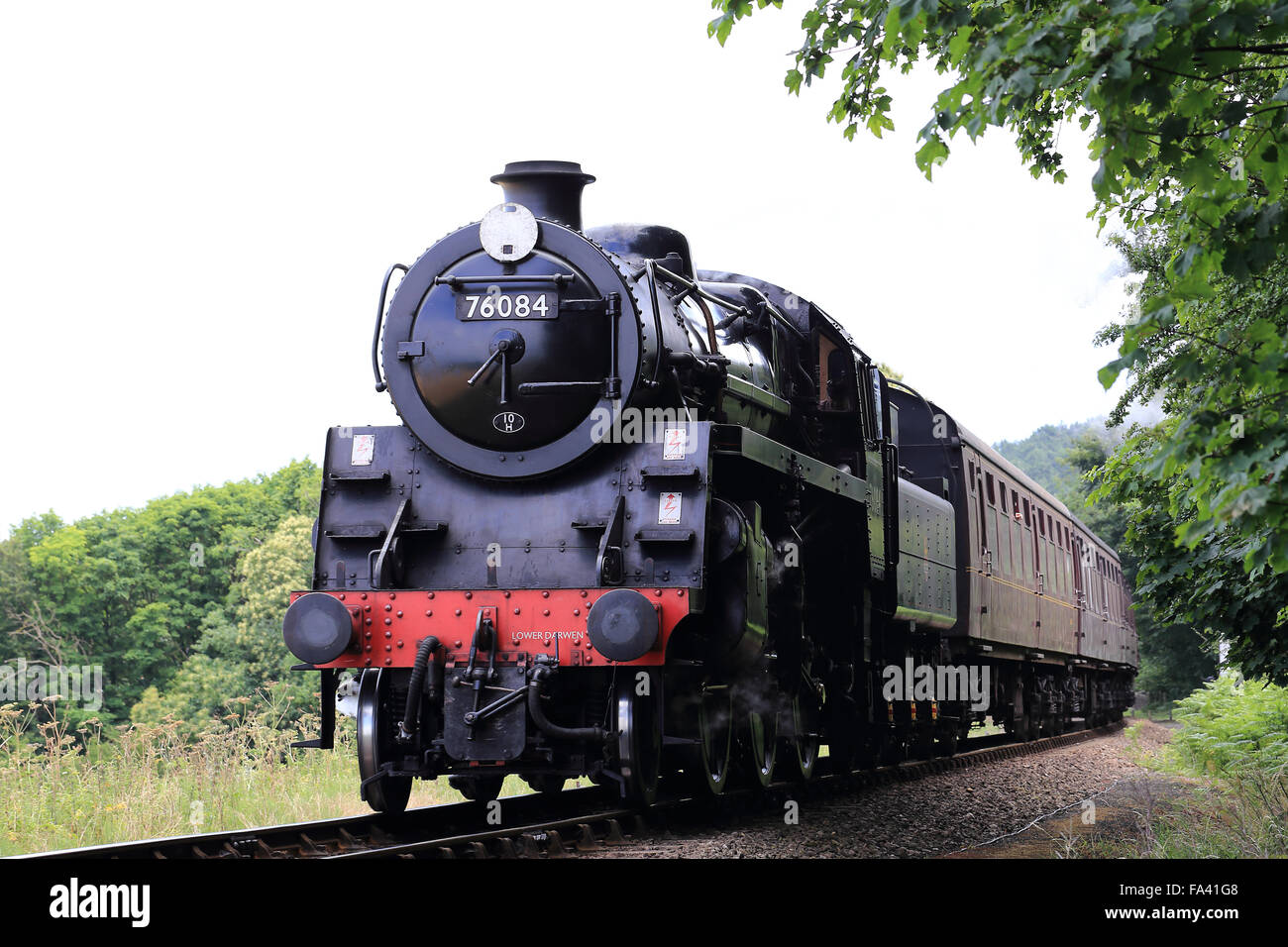 Steam locomotive, 76084, (a Standard 4 class) pulling a train on the ...