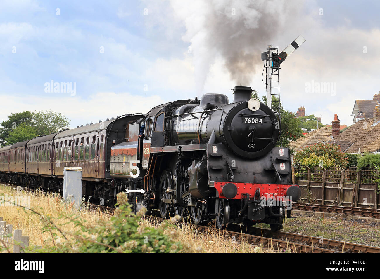 Steam locomotive, 76084, (a Standard 4 class) pulling a train on the ...
