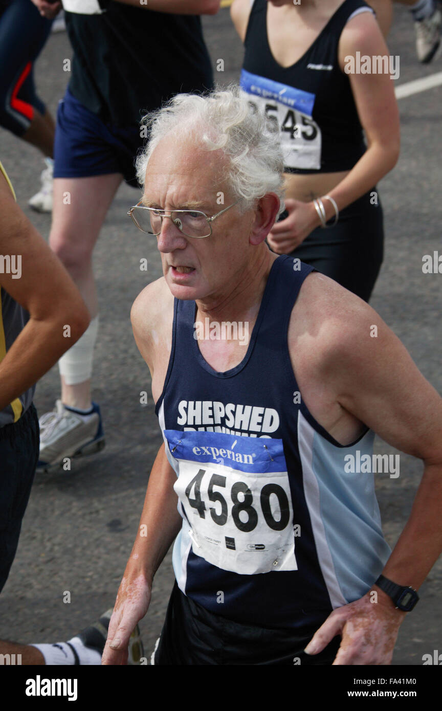Older man running runner in the Nottingham Robin Hood Marathon; held ...