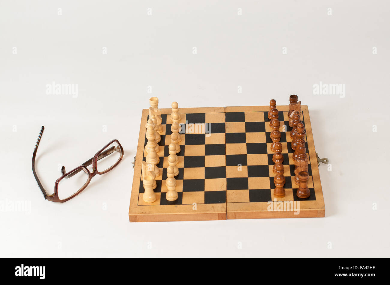 The chess game board in the photo with a white base and background with ...