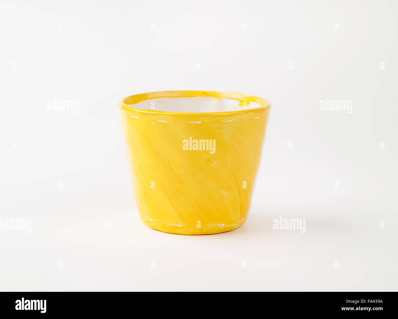 empty yellow flower pot on white background Stock Photo - Alamy