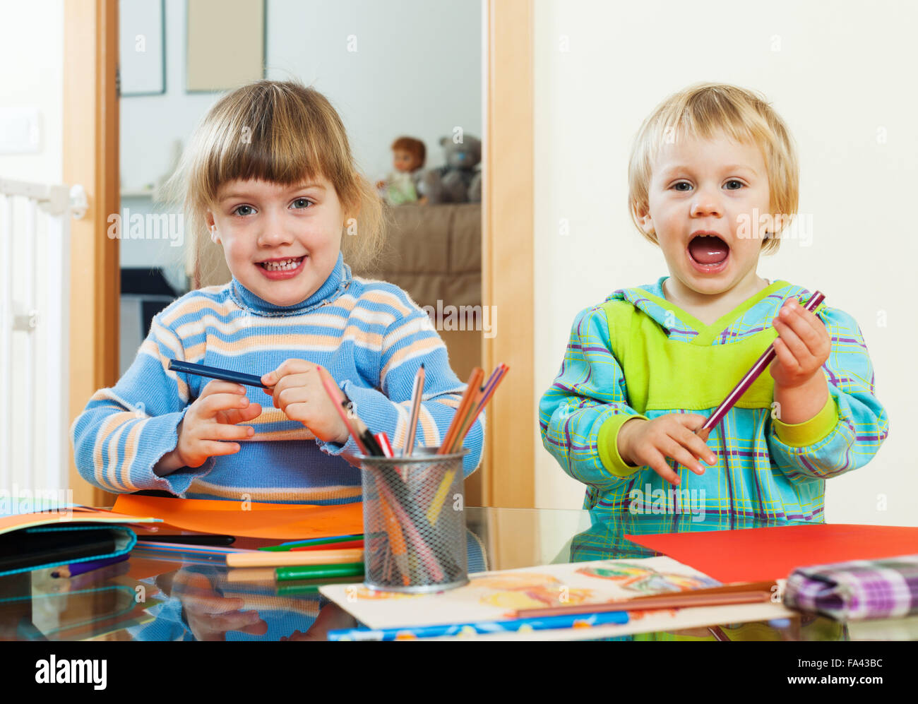 happy children playing with paper and pencils Stock Photo - Alamy