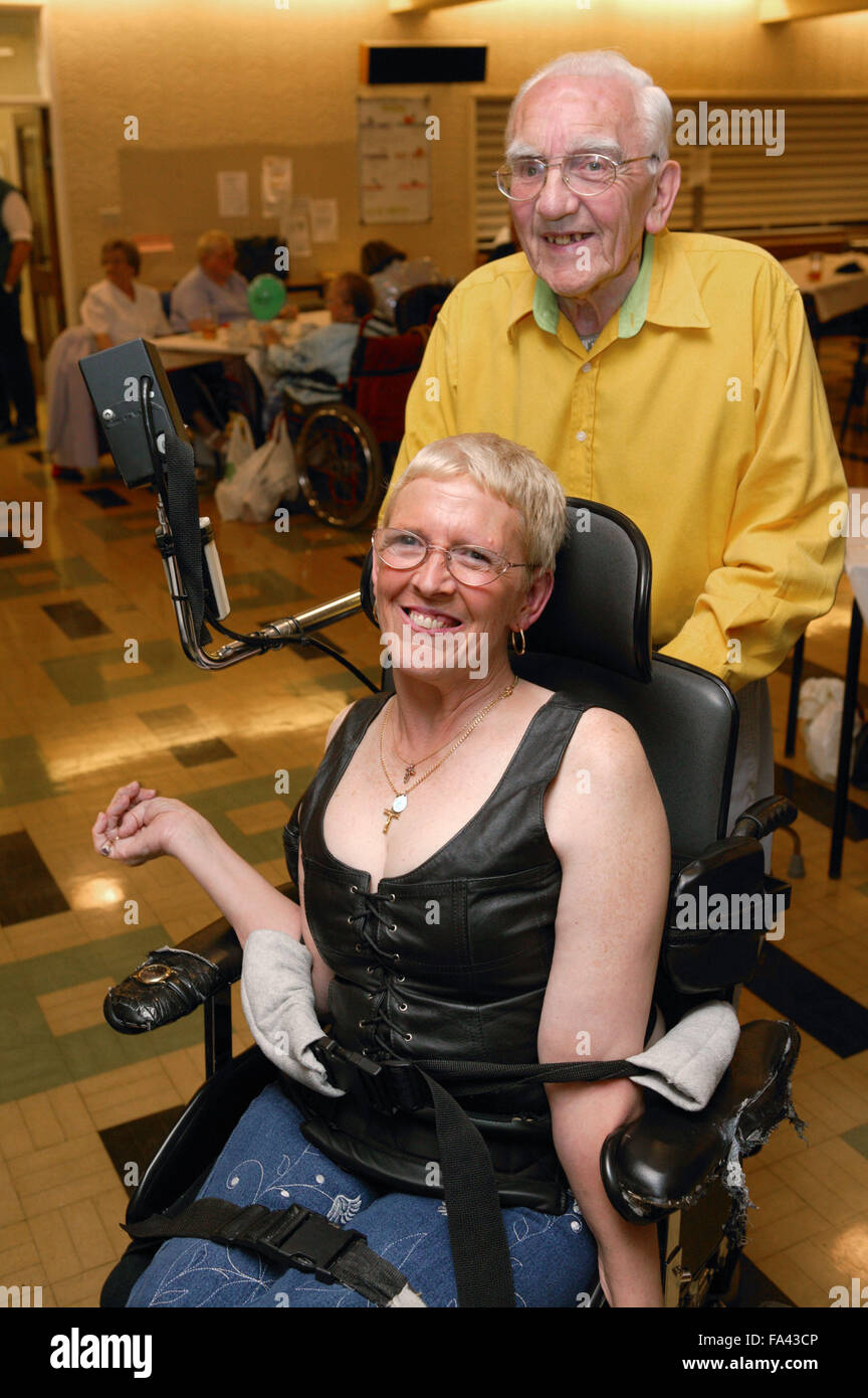 Woman wheelchair user and partner at a disability friendship club ...
