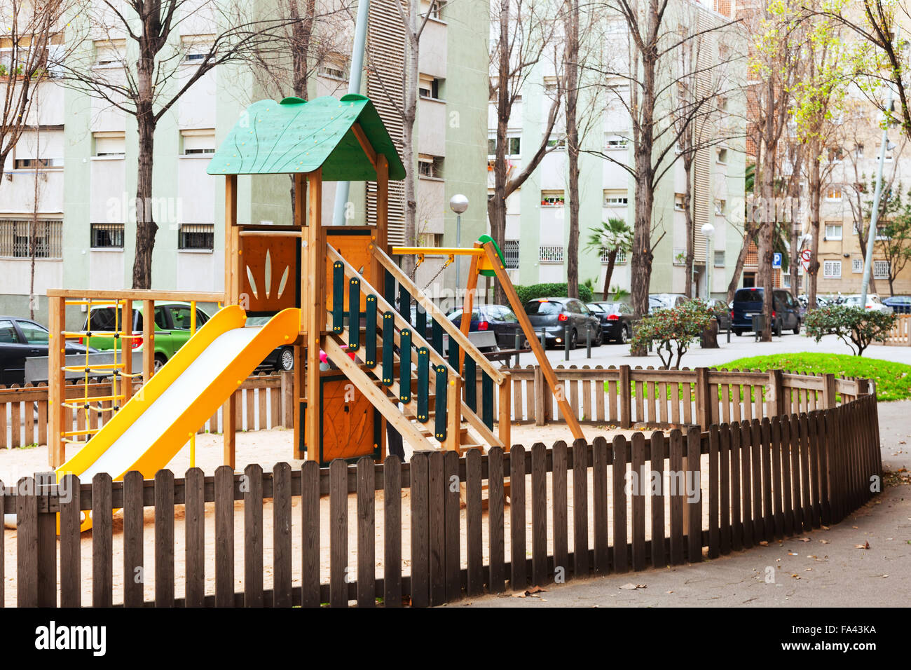 Wooden playground in city yard Stock Photo - Alamy