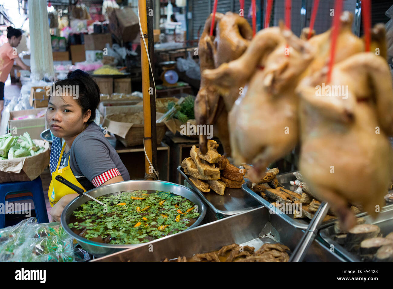 Selling chicken. Market stall and street food being prepared in ...