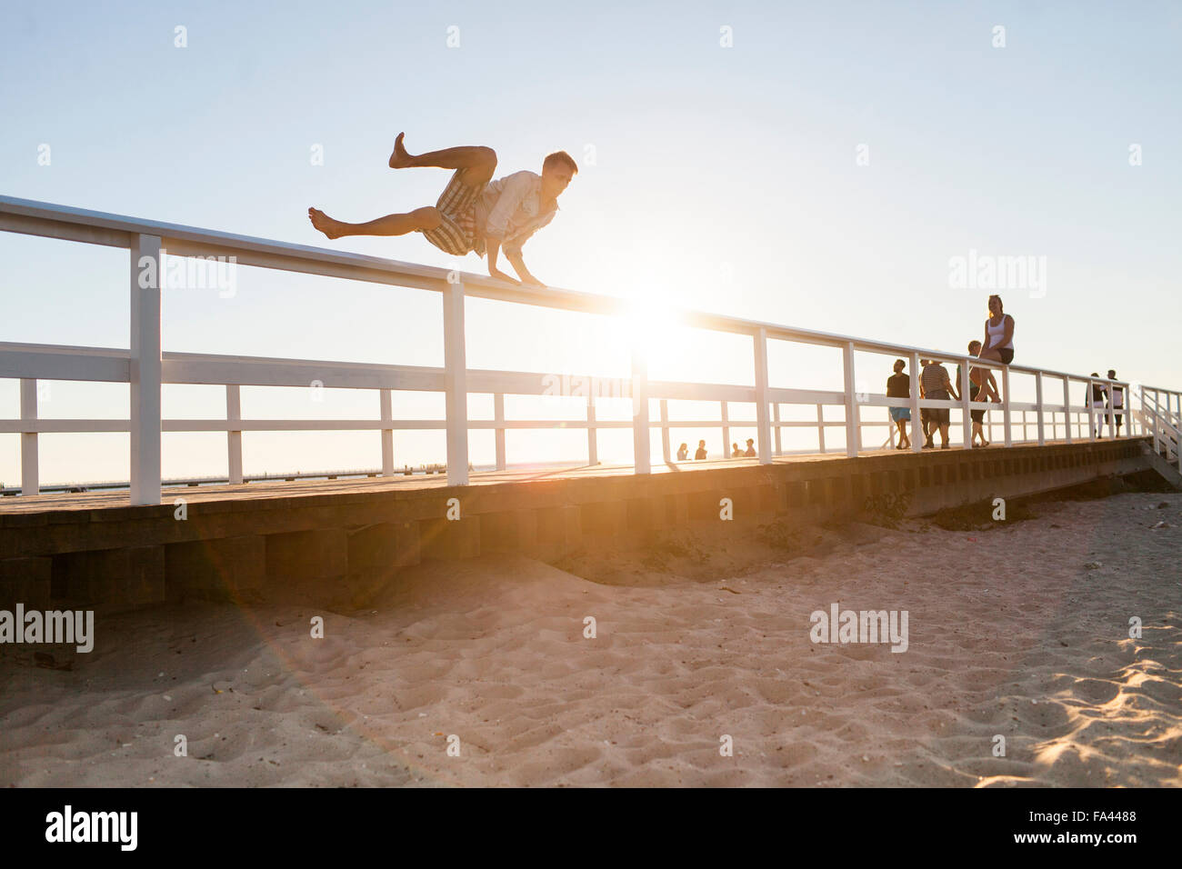Man jumping over railings hi-res stock photography and images - Alamy