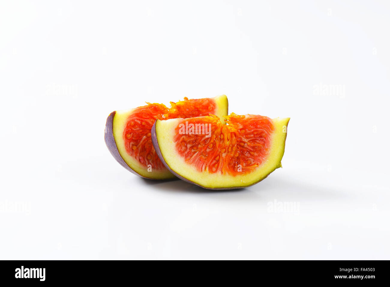 Fresh fig cut into wedges Stock Photo - Alamy