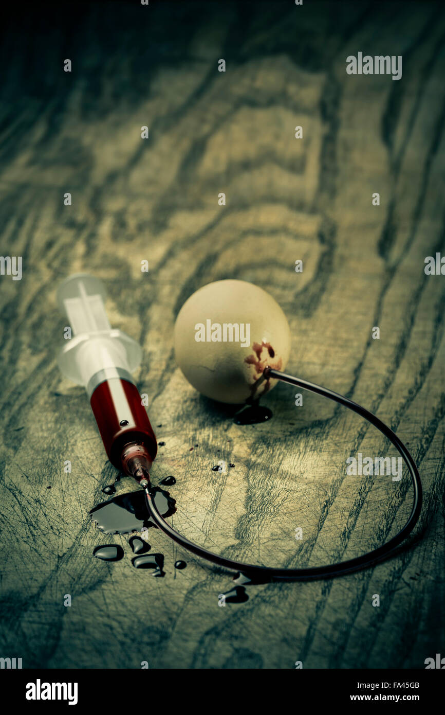 Bloody experiments on chicken eggs Stock Photo - Alamy