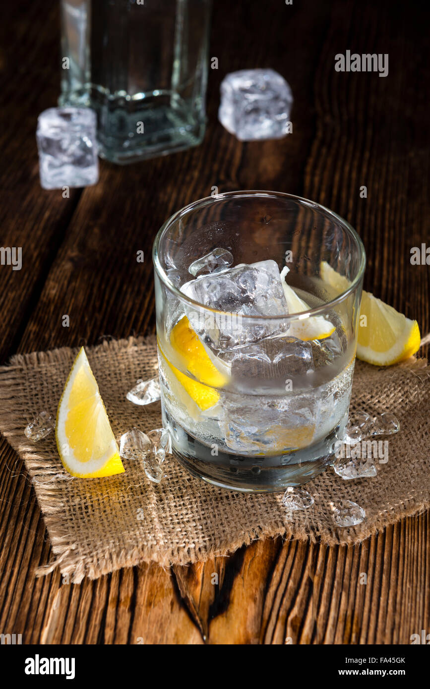 Shot of ice cold Vodka on rustic wooden background Stock Photo - Alamy